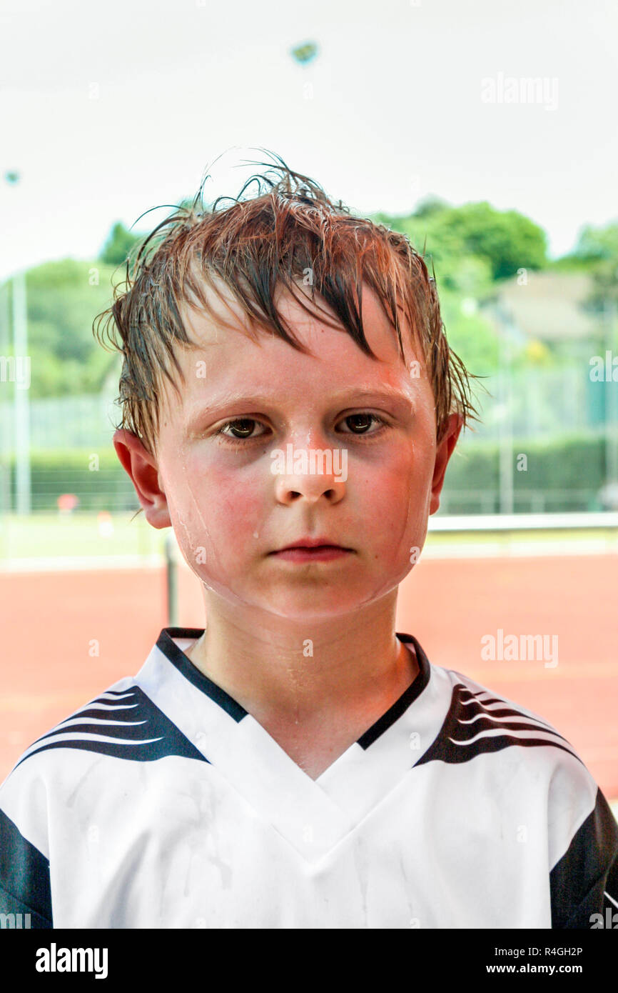 Kids playing football head hi-res stock photography and images - Alamy