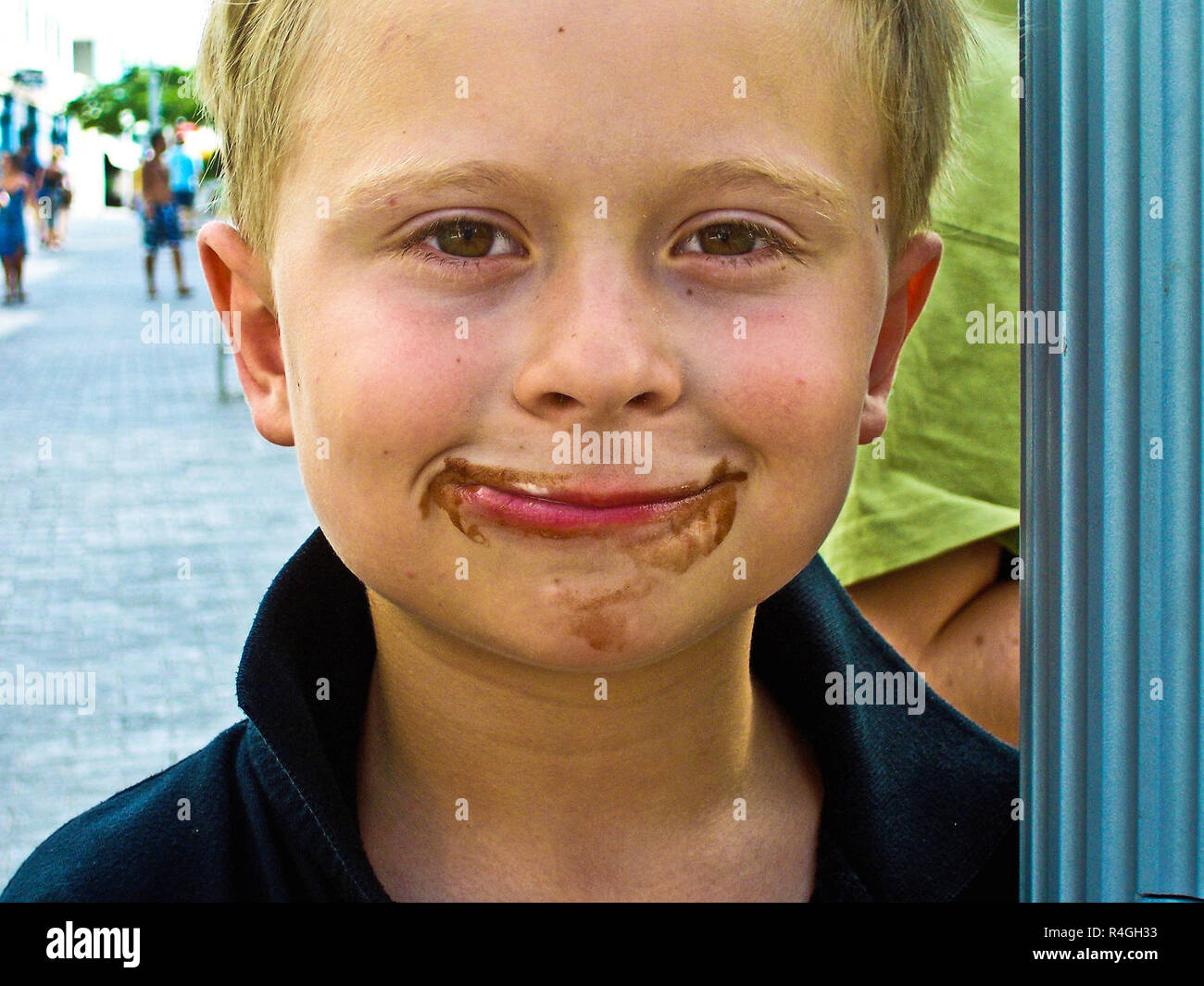 child has chocolate around his mouth and smiles Stock Photo - Alamy