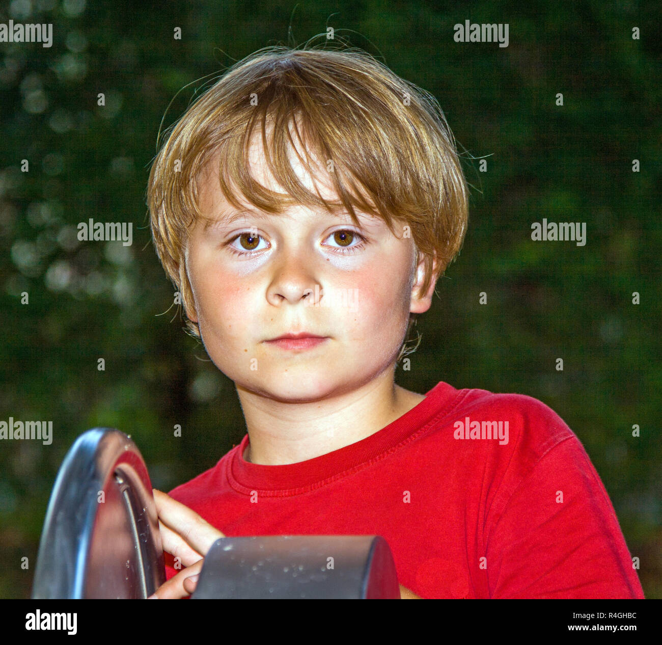 portrait of a young boy looking concentrated Stock Photo - Alamy
