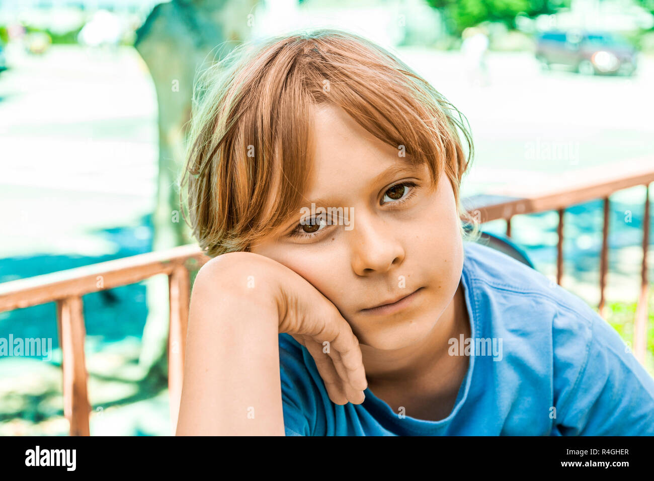 boy with brown hair looking displeased Stock Photo - Alamy