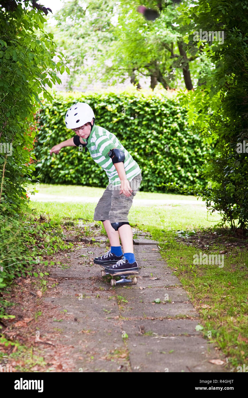 young boy on his skate board Stock Photo - Alamy