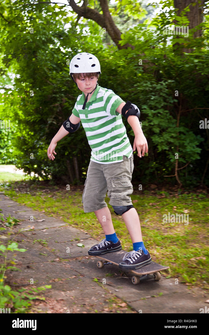 young boy on his skate board Stock Photo - Alamy