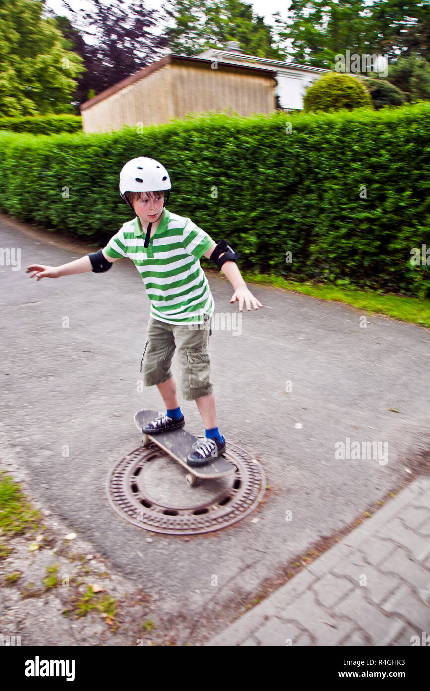 young boy on his skate board Stock Photo - Alamy