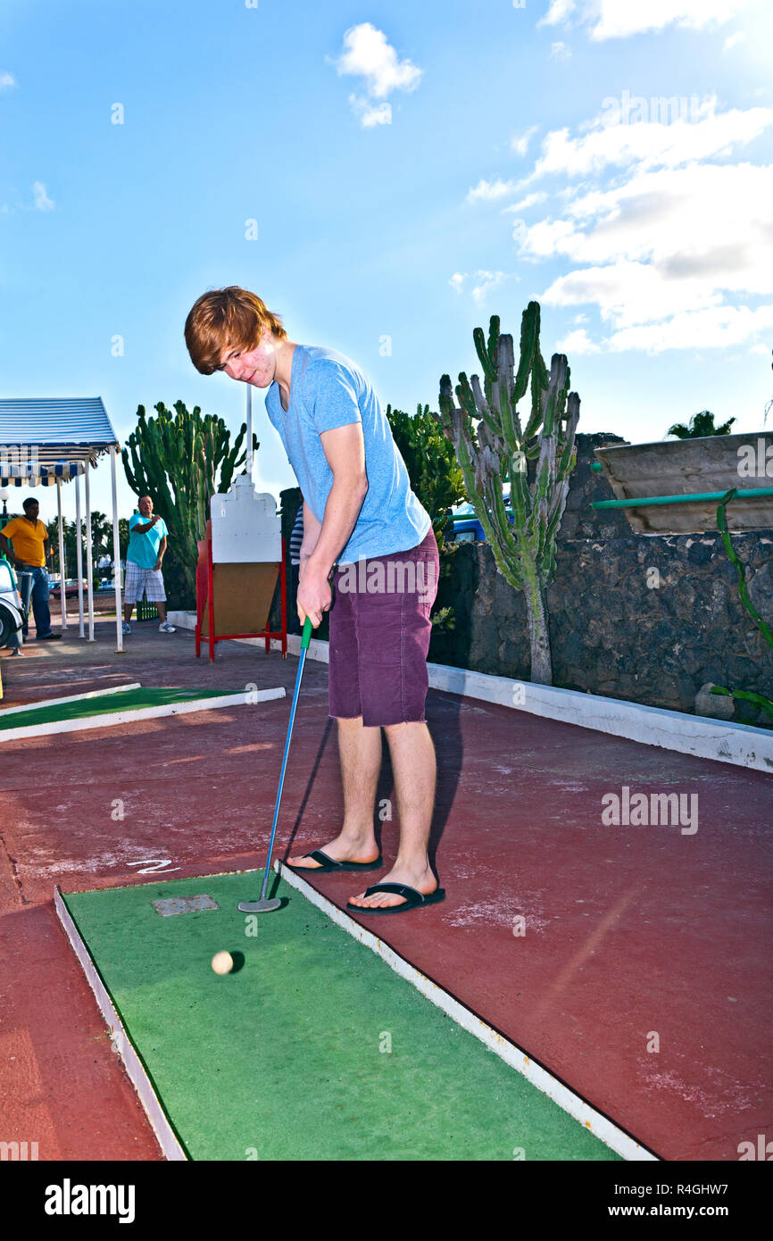 boy playing mini golf in the course Stock Photo - Alamy