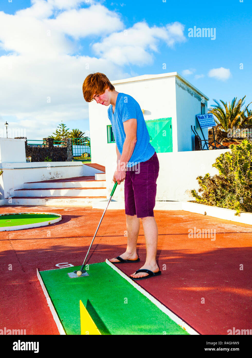 boy playing mini golf in the course Stock Photo - Alamy