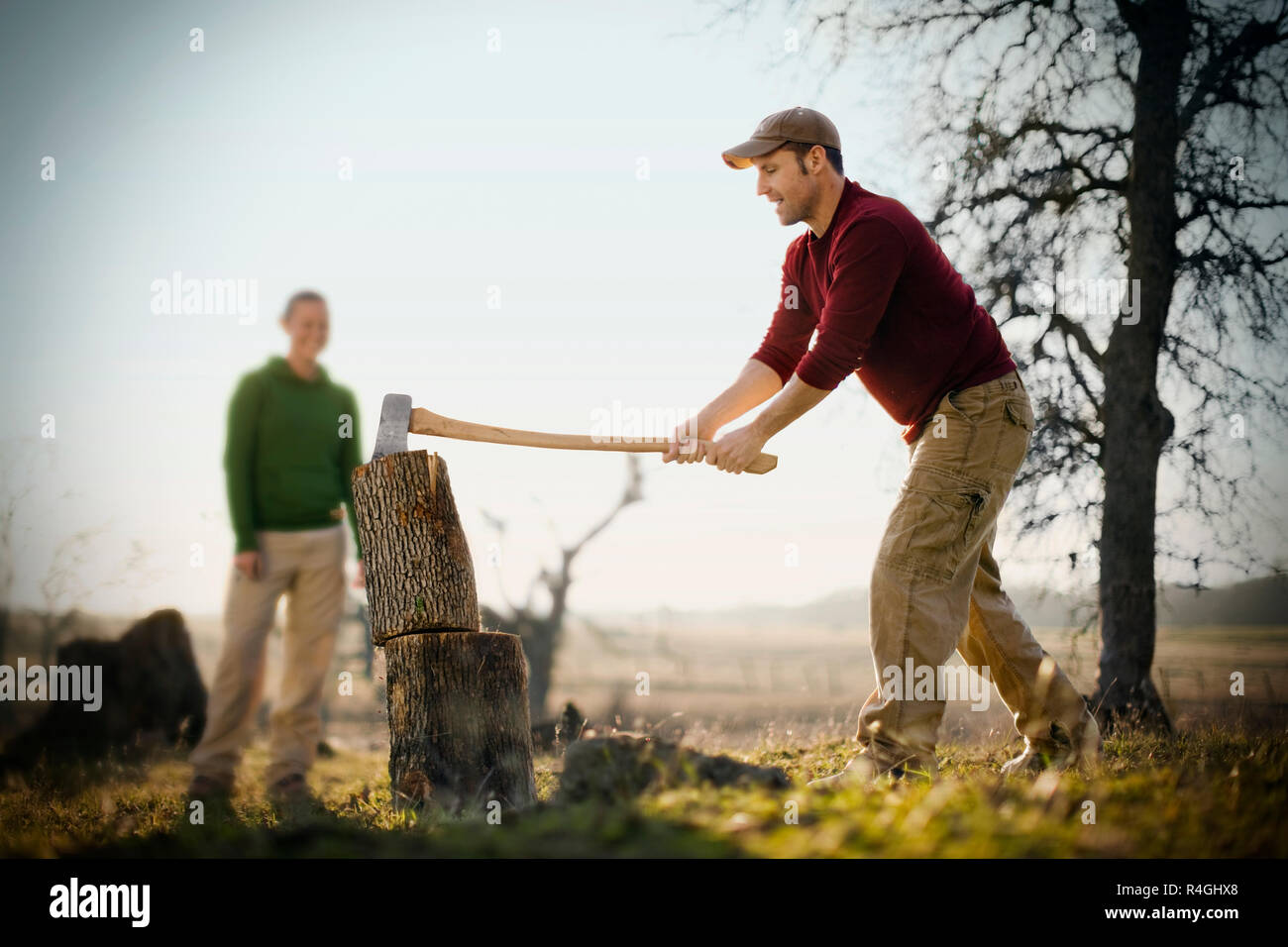 A Man Chopping Wood With An Axe High Resolution Stock Photography and ...