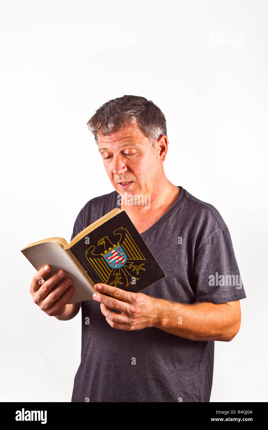 man reading in a law book Stock Photo - Alamy