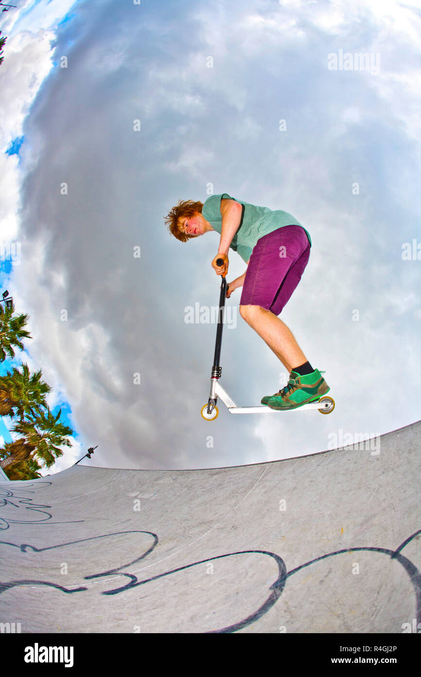 boy with scooter is going airborne Stock Photo - Alamy