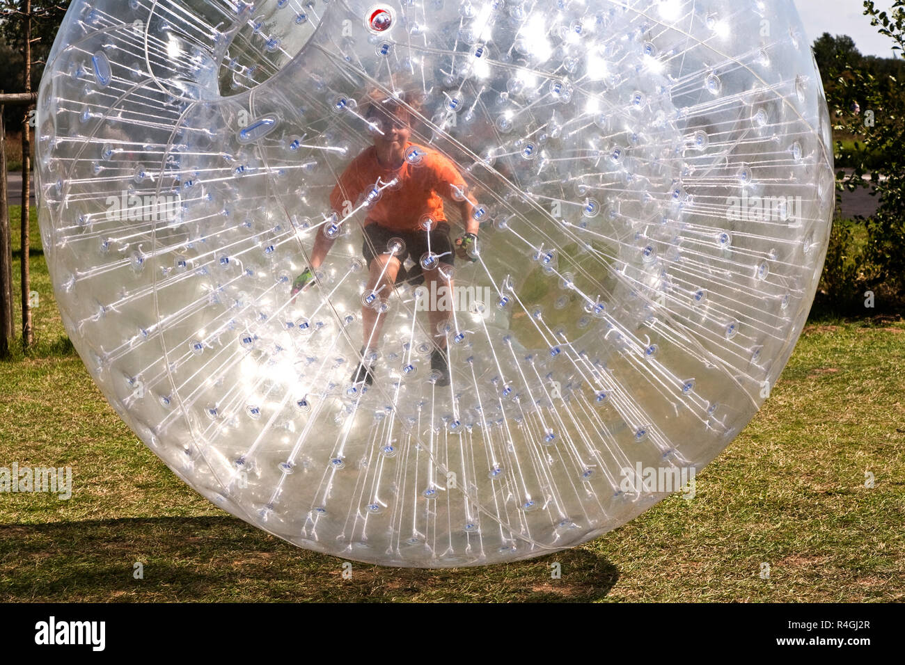 child has a lot of fun in the Zorbing Ball Stock Photo - Alamy