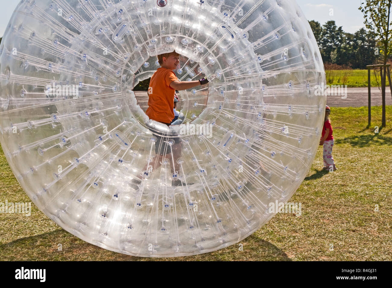 child has a lot of fun in the Zorbing Ball Stock Photo - Alamy
