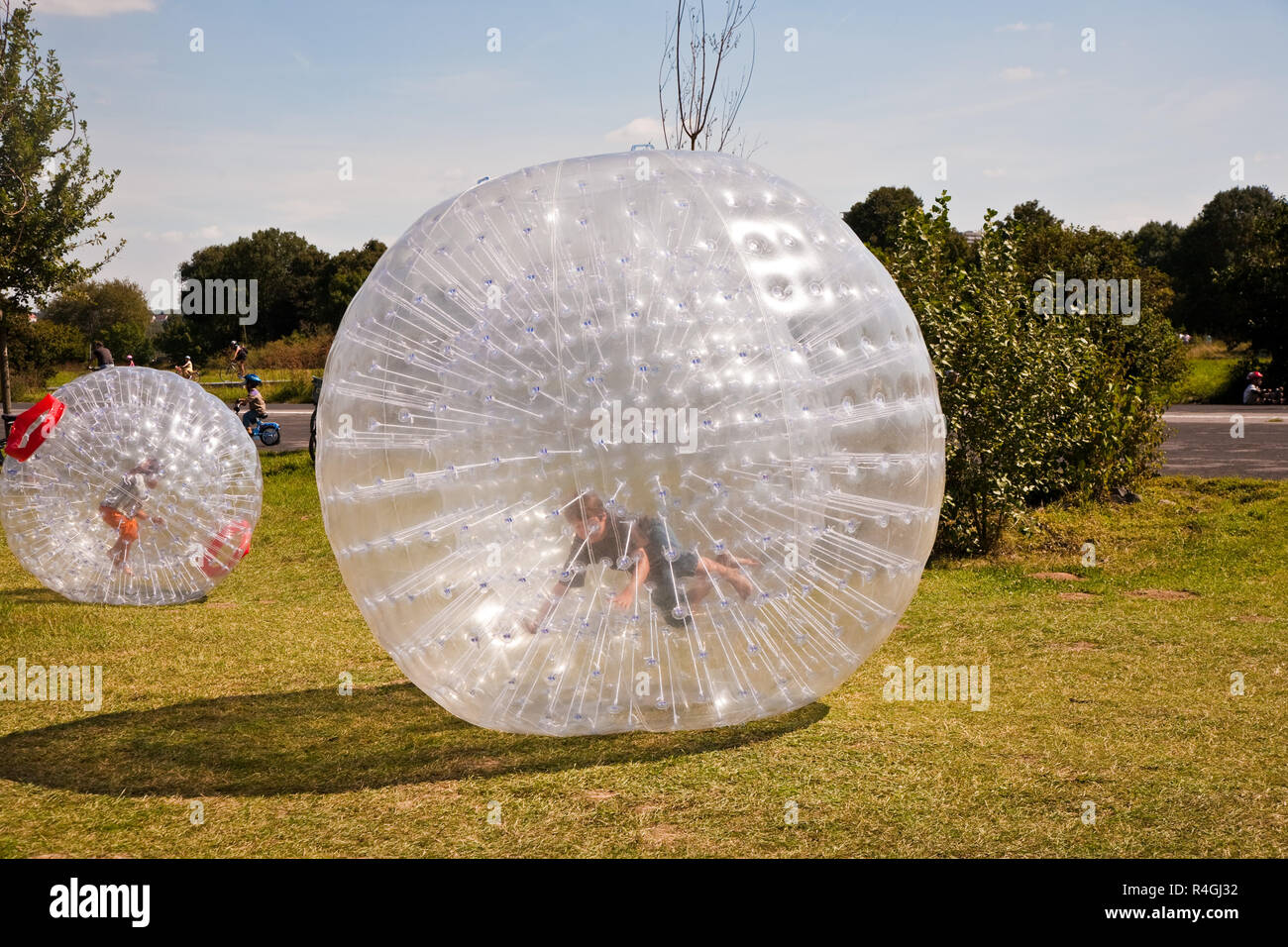 child has a lot of fun in the Zorbing Ball Stock Photo - Alamy