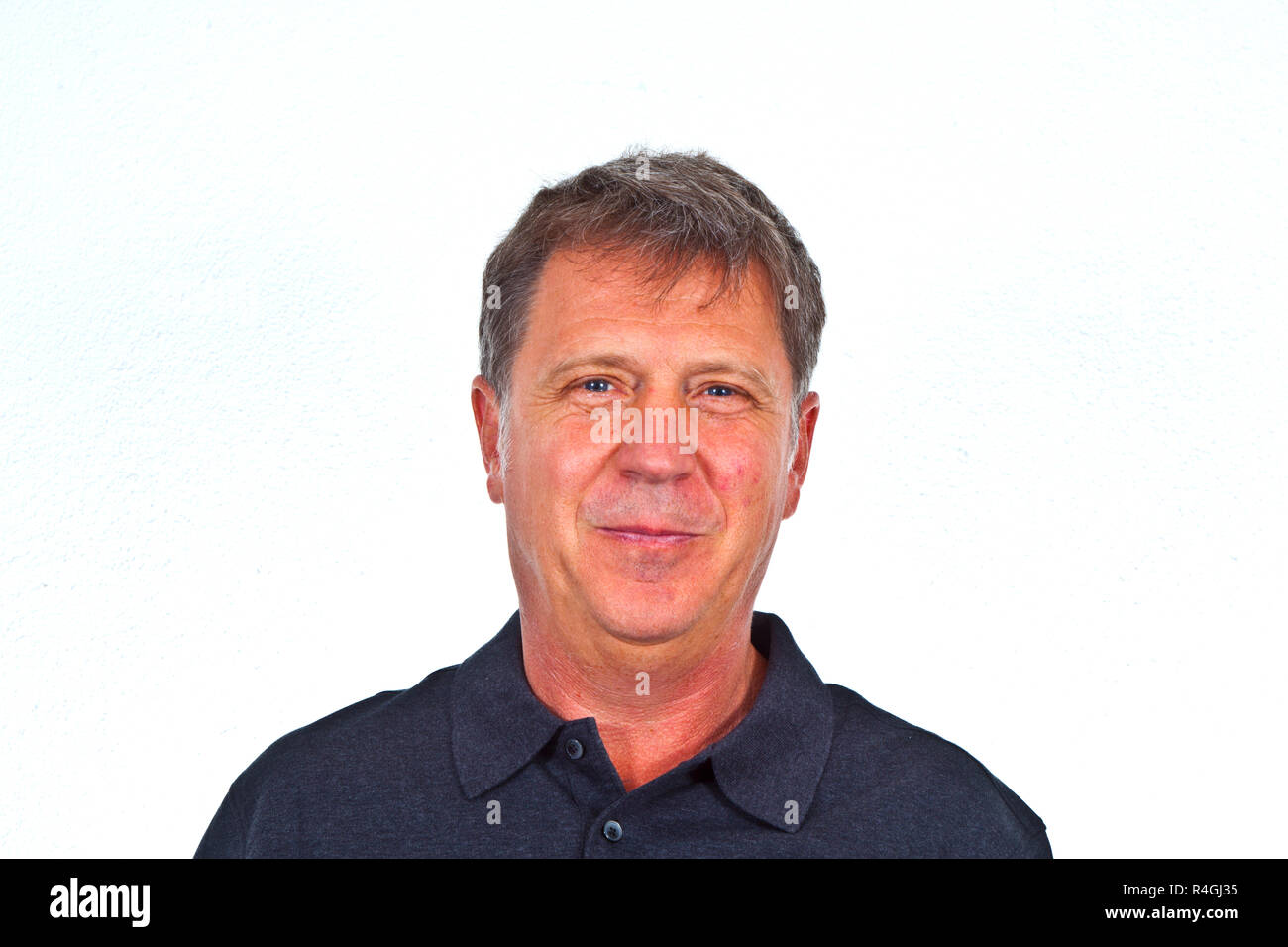 smart smiling man in studio Stock Photo - Alamy