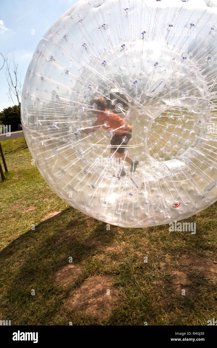 child has a lot of fun in the Zorbing Ball Stock Photo - Alamy