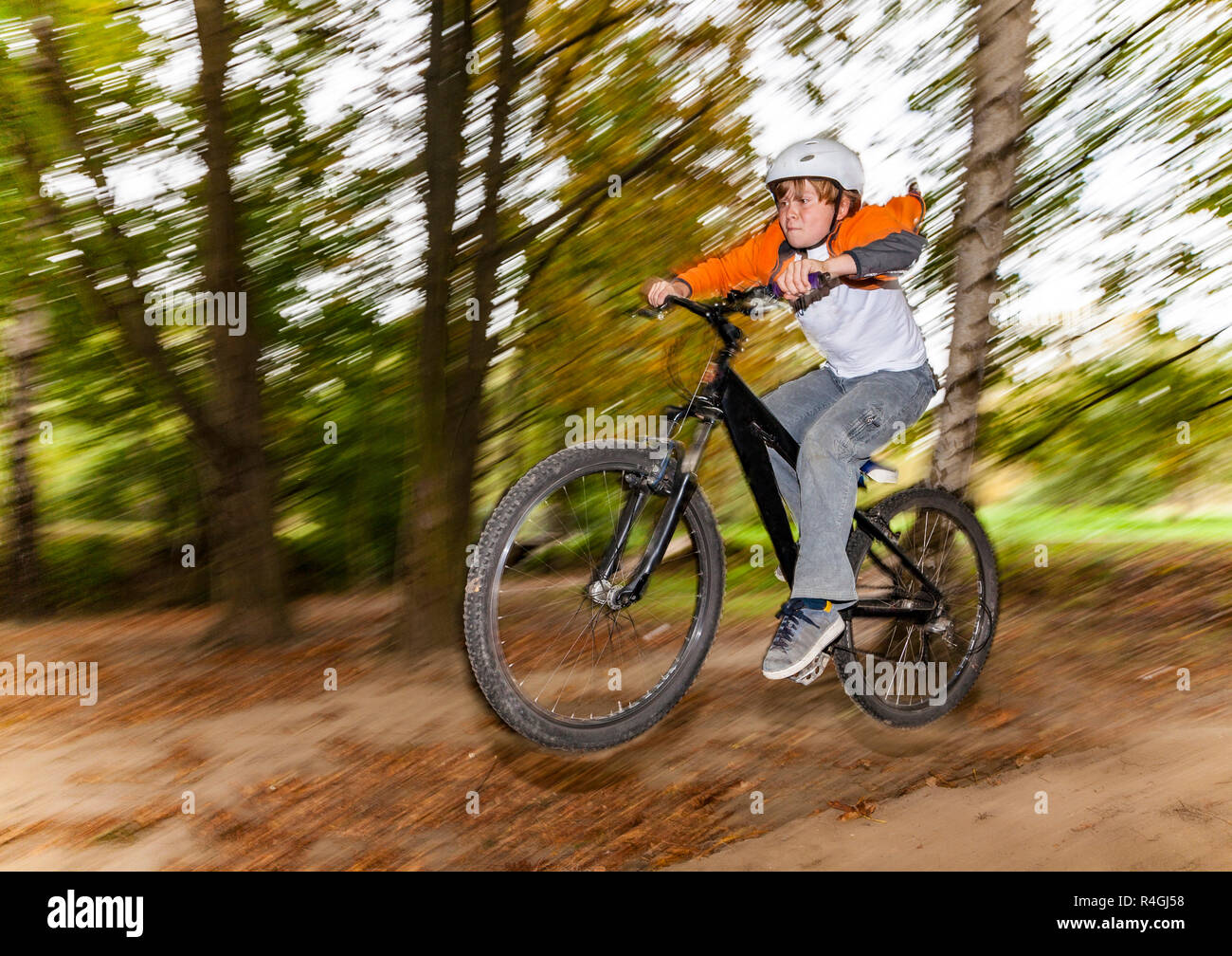 boy jumping over a ramp Stock Photo - Alamy