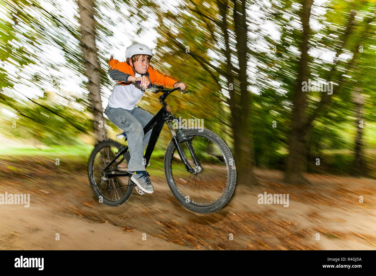 boy jumping over a ramp Stock Photo - Alamy