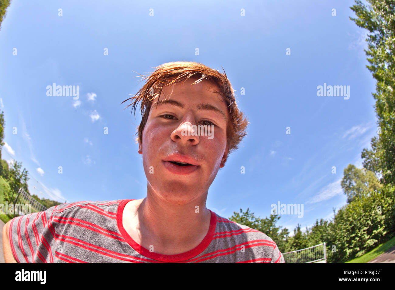 young happy boy sweating and exhausted from sports Stock Photo - Alamy