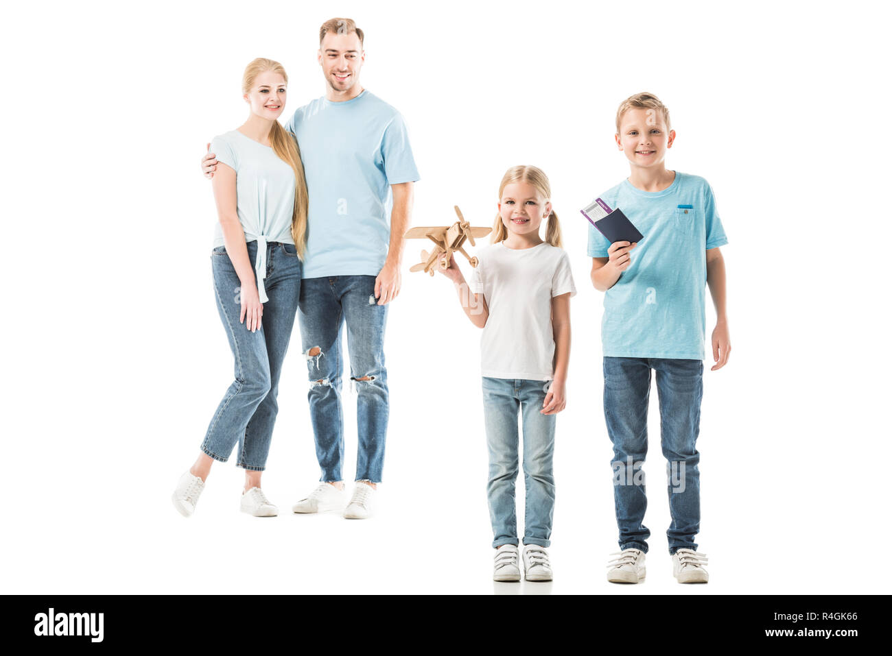 Happy parents smiling and looking at kids isolated on white Stock Photo ...