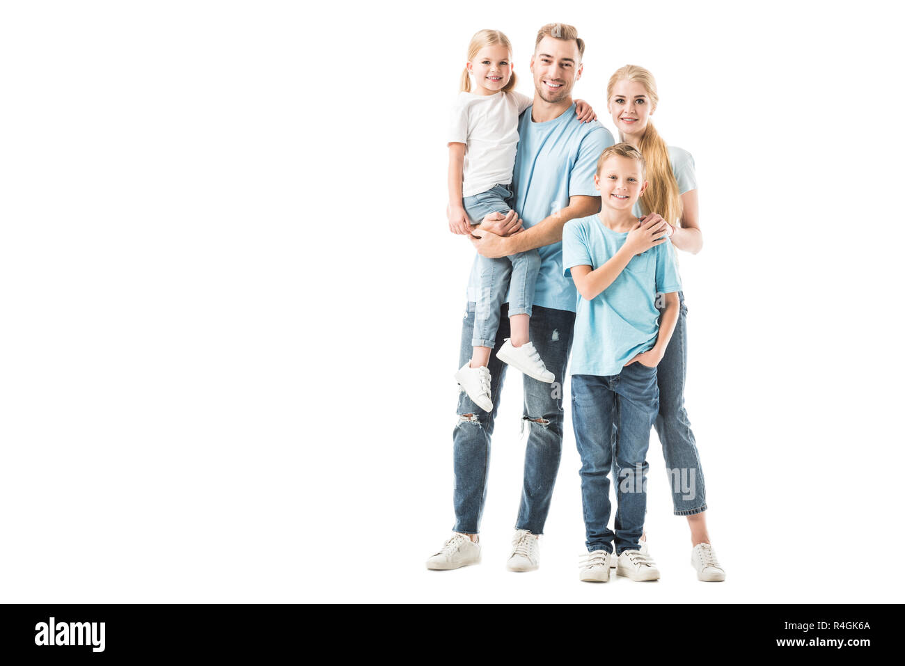Happy family standing and smiling isolated on white Stock Photo - Alamy