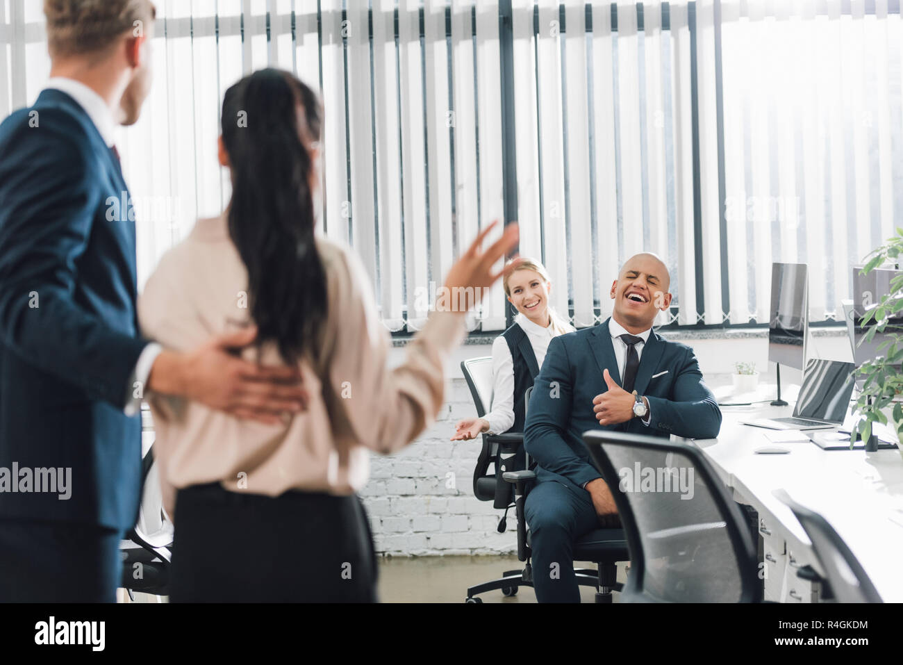 businessman introducing new colleague waving hand and greeting ...