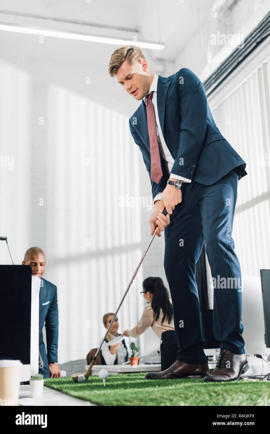 Playing golf at office hi-res stock photography and images - Alamy