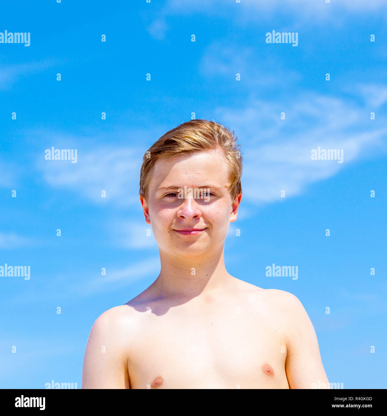 handsome smiling boy after swimming at the beach Stock Photo - Alamy