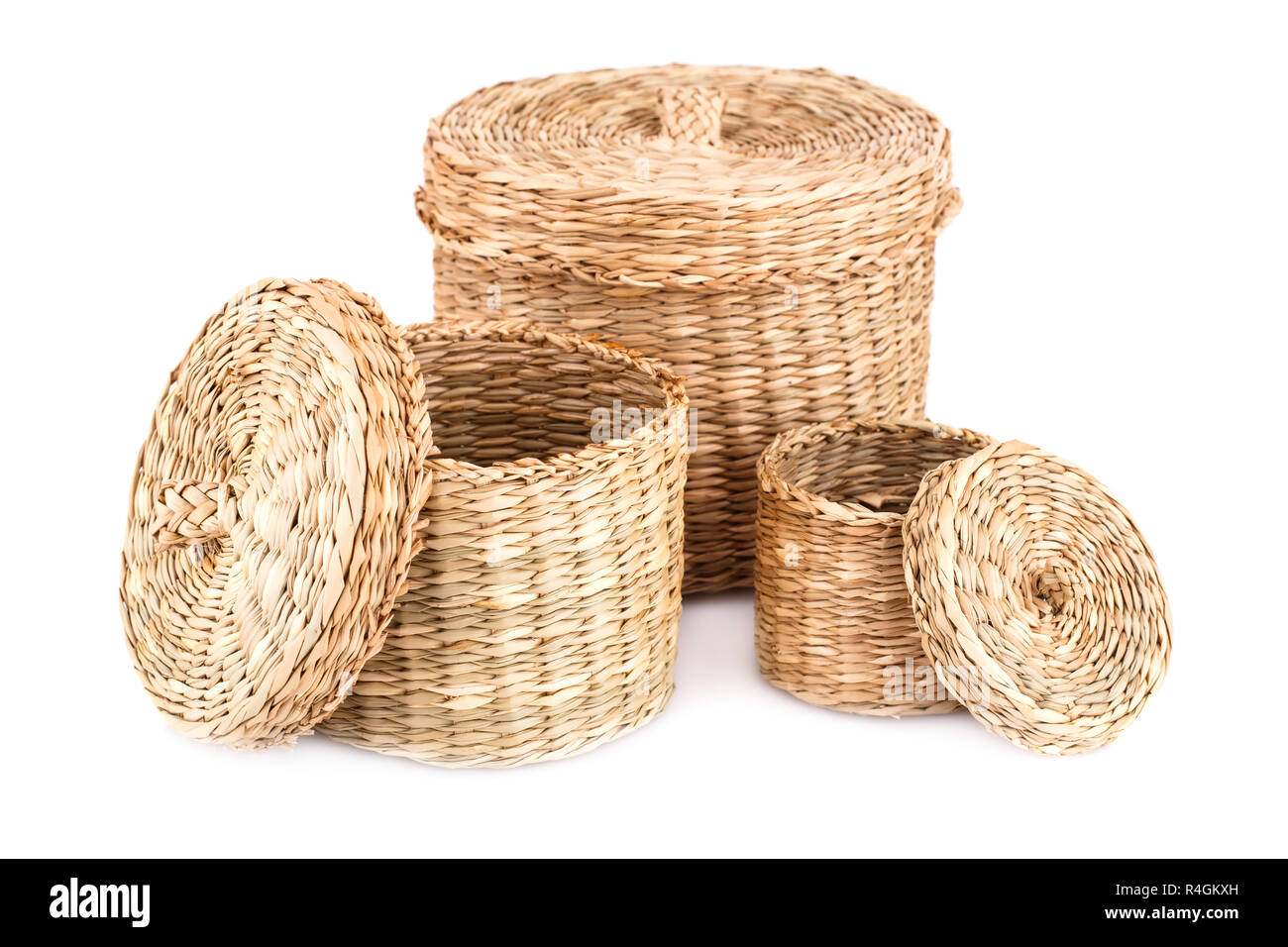 Three wicker boxes isolated on white background Stock Photo - Alamy