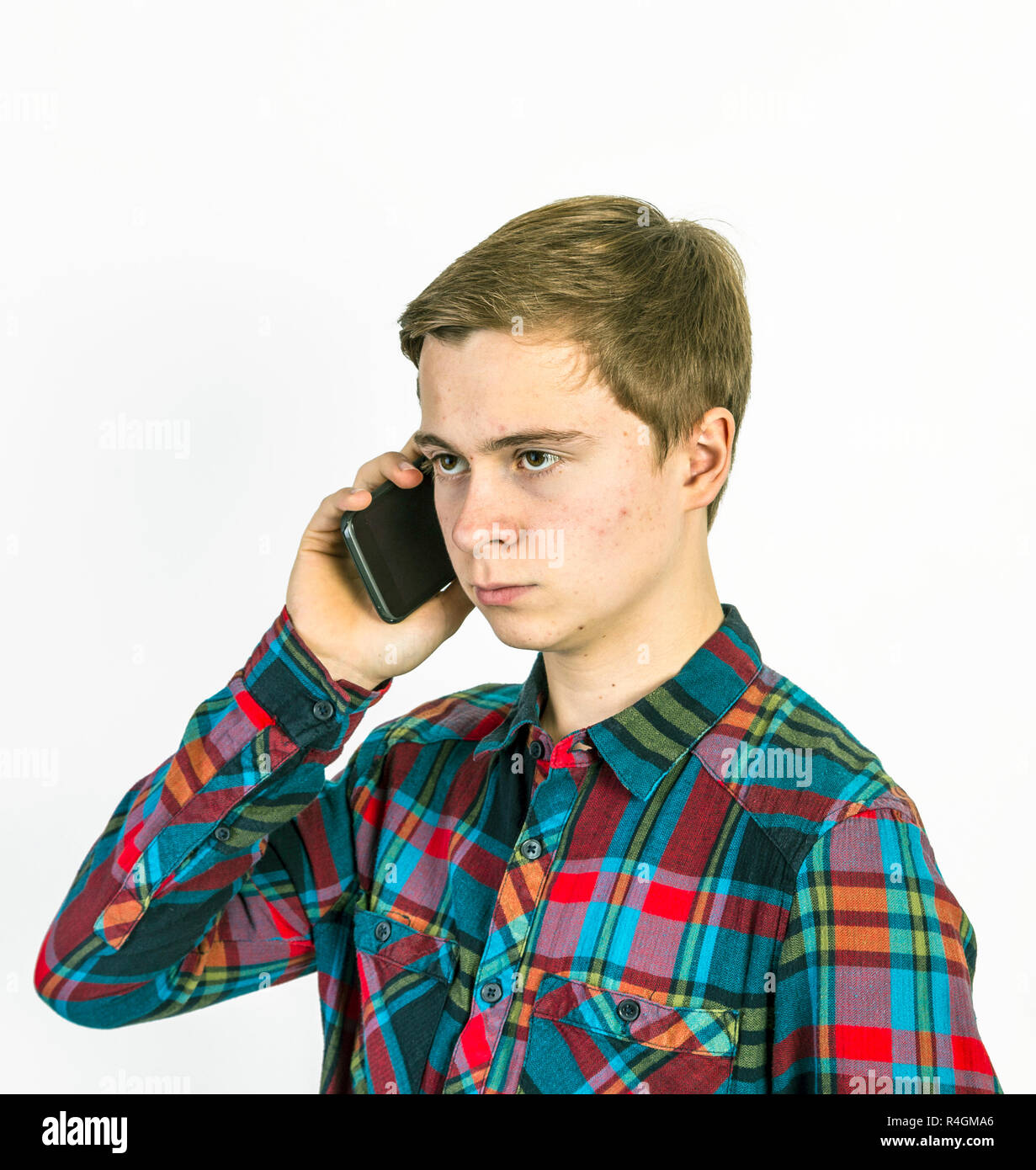 teenage boy uses the mobile Stock Photo - Alamy