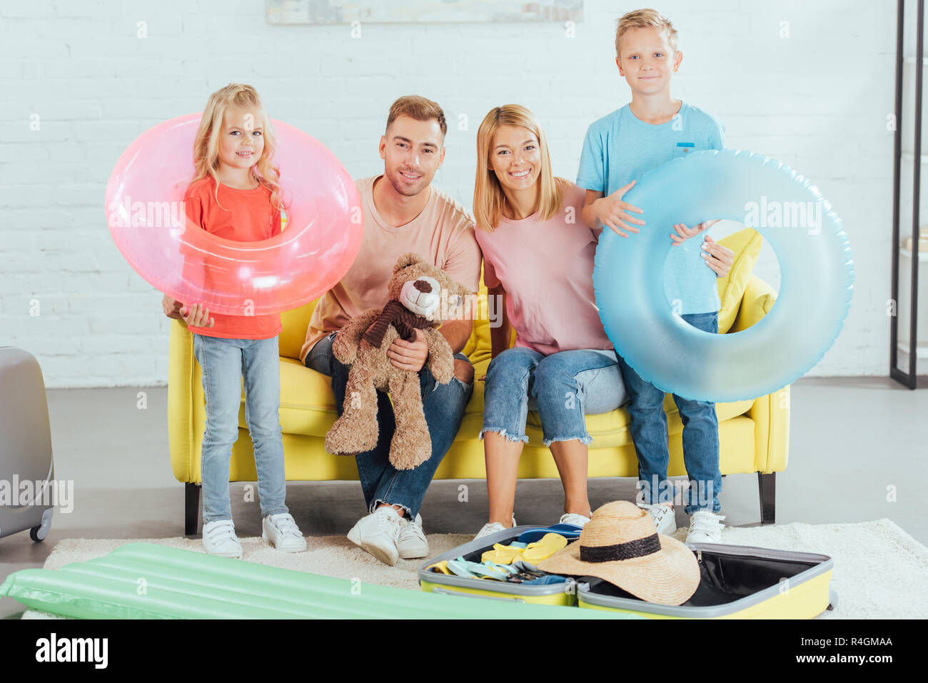 happy family packing baggage for summer vacation, travel concept Stock ...