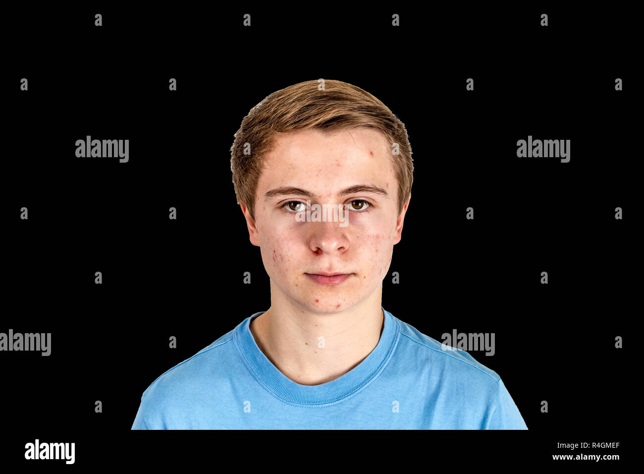 cool boy with blue shirt posing in studio Stock Photo - Alamy