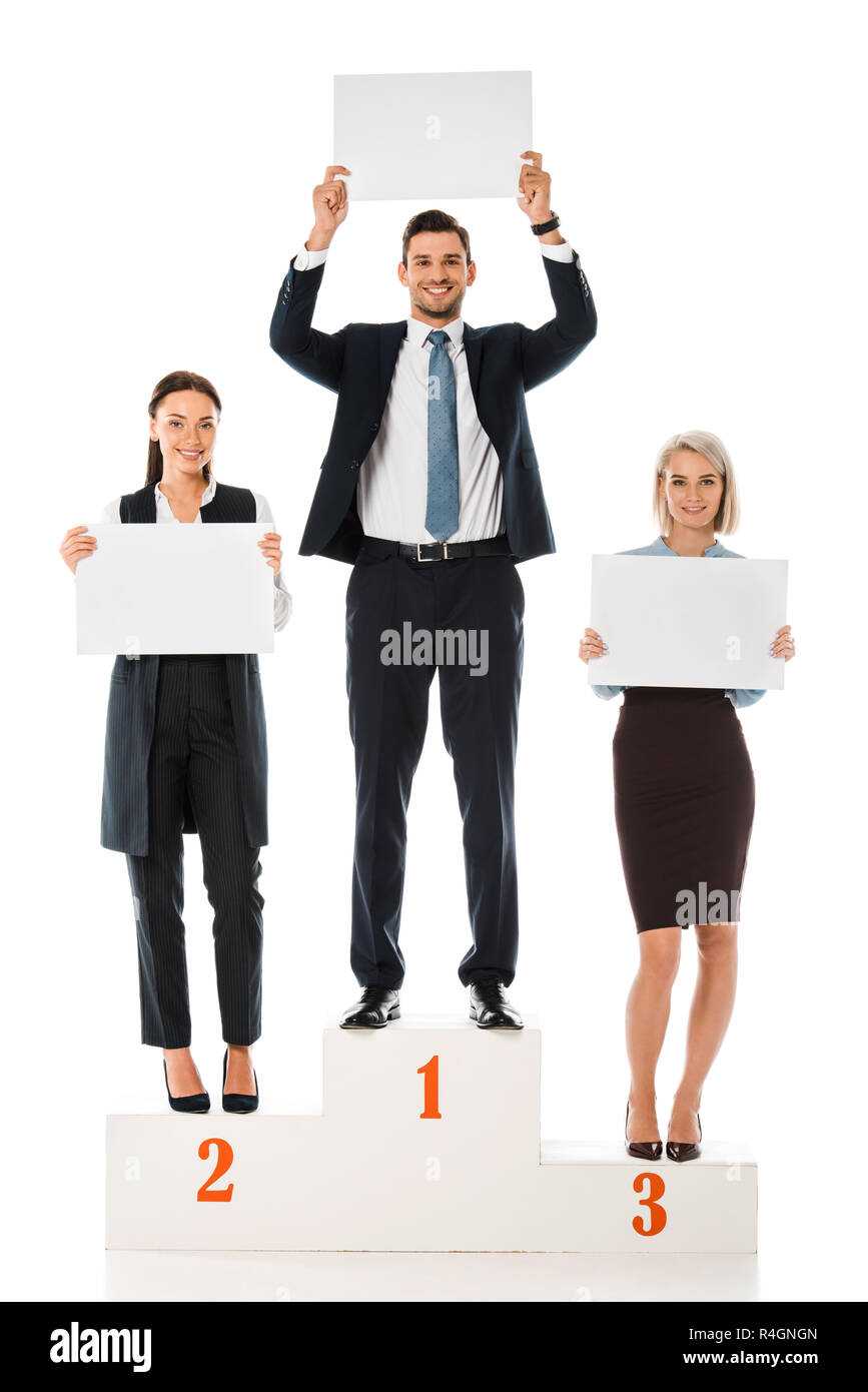 businesspeople holding blank placards while standing on winners podium ...