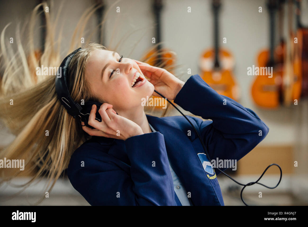 Enjoying Music At School Stock Photo - Alamy