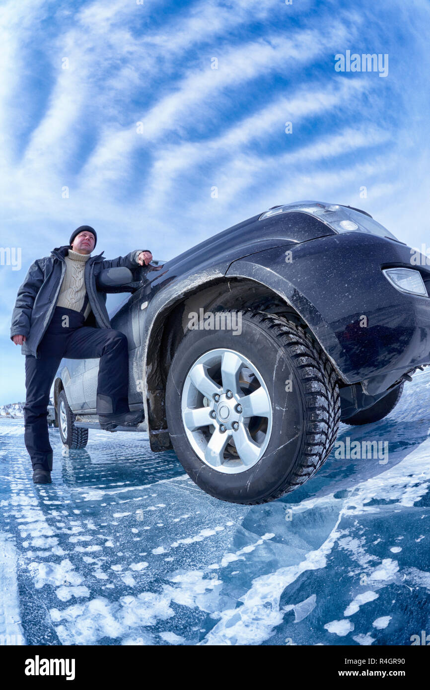 Wide-angle shot of car and driver on Baikal ice Stock Photo - Alamy