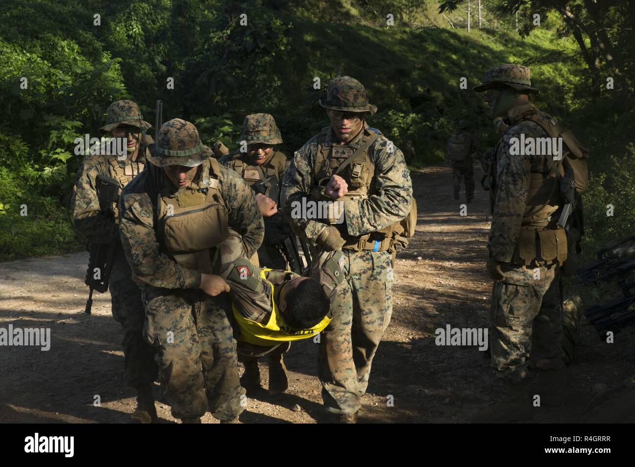 U.S. Marines with Task Force Koa Moana carry a simulated casualty ...