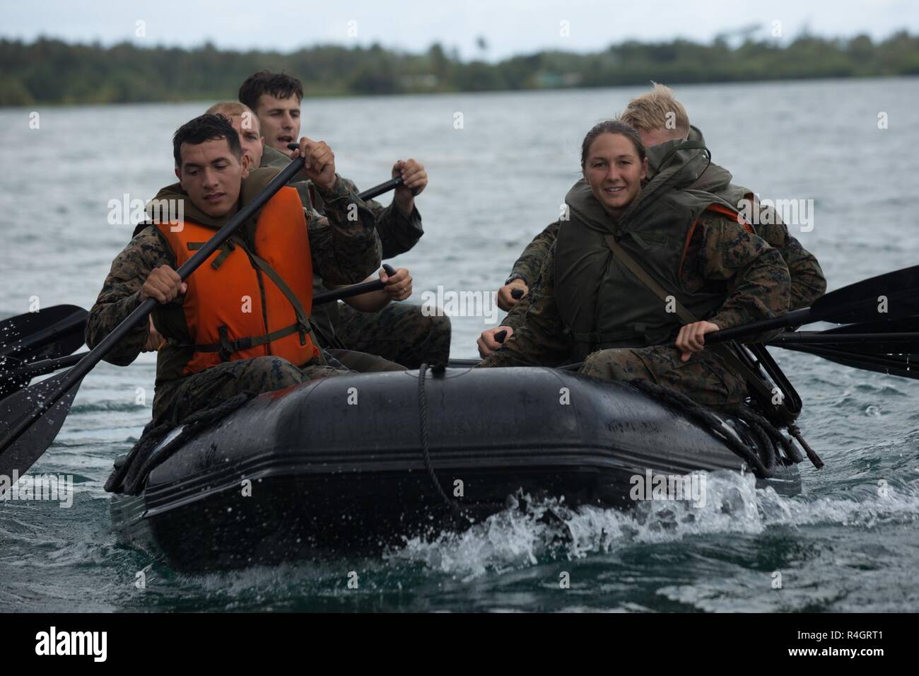 U.S Marines, with Task Force Koa Moana, row a French Army Zodiac boat ...
