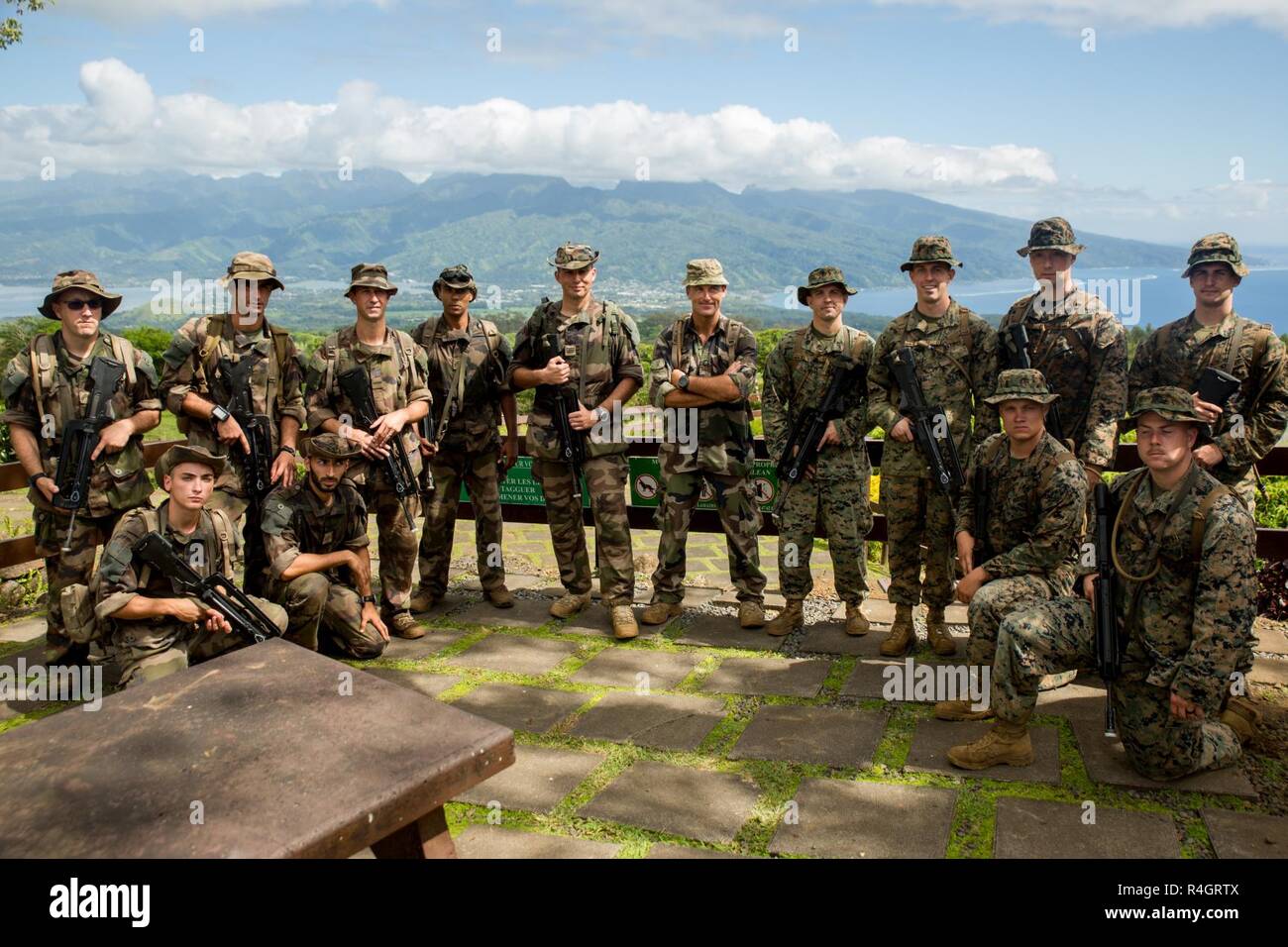 U.S. Marines, with Task Force Koa Moana, pose for a group photo with ...