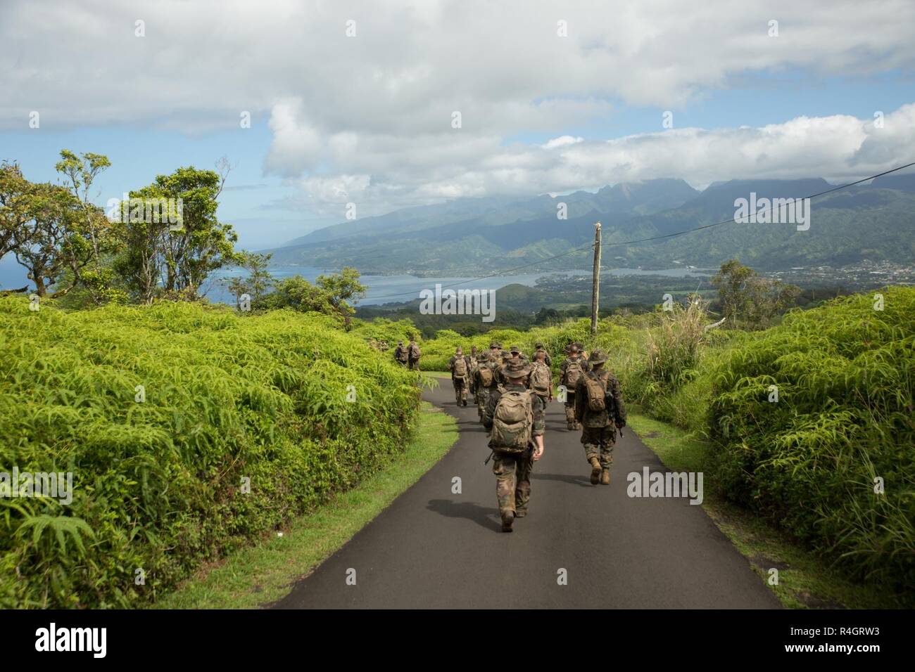 U.S. Marines and Sailors, with Task Force Koa Moana, hike with French ...