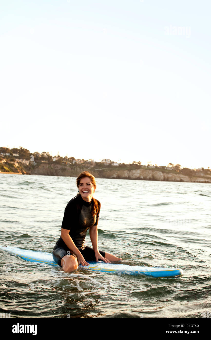 Ocean surfers sitting surfboards hi-res stock photography and images ...