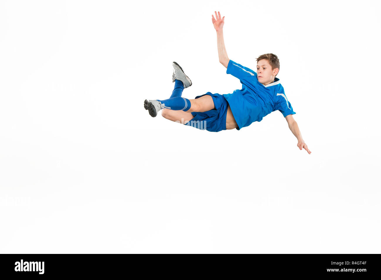 Boy bouncing football hi-res stock photography and images - Alamy