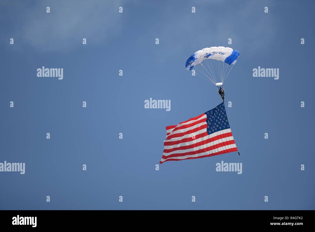 A member of the U.S. Air Force Academy Wings of Blue parachute team ...
