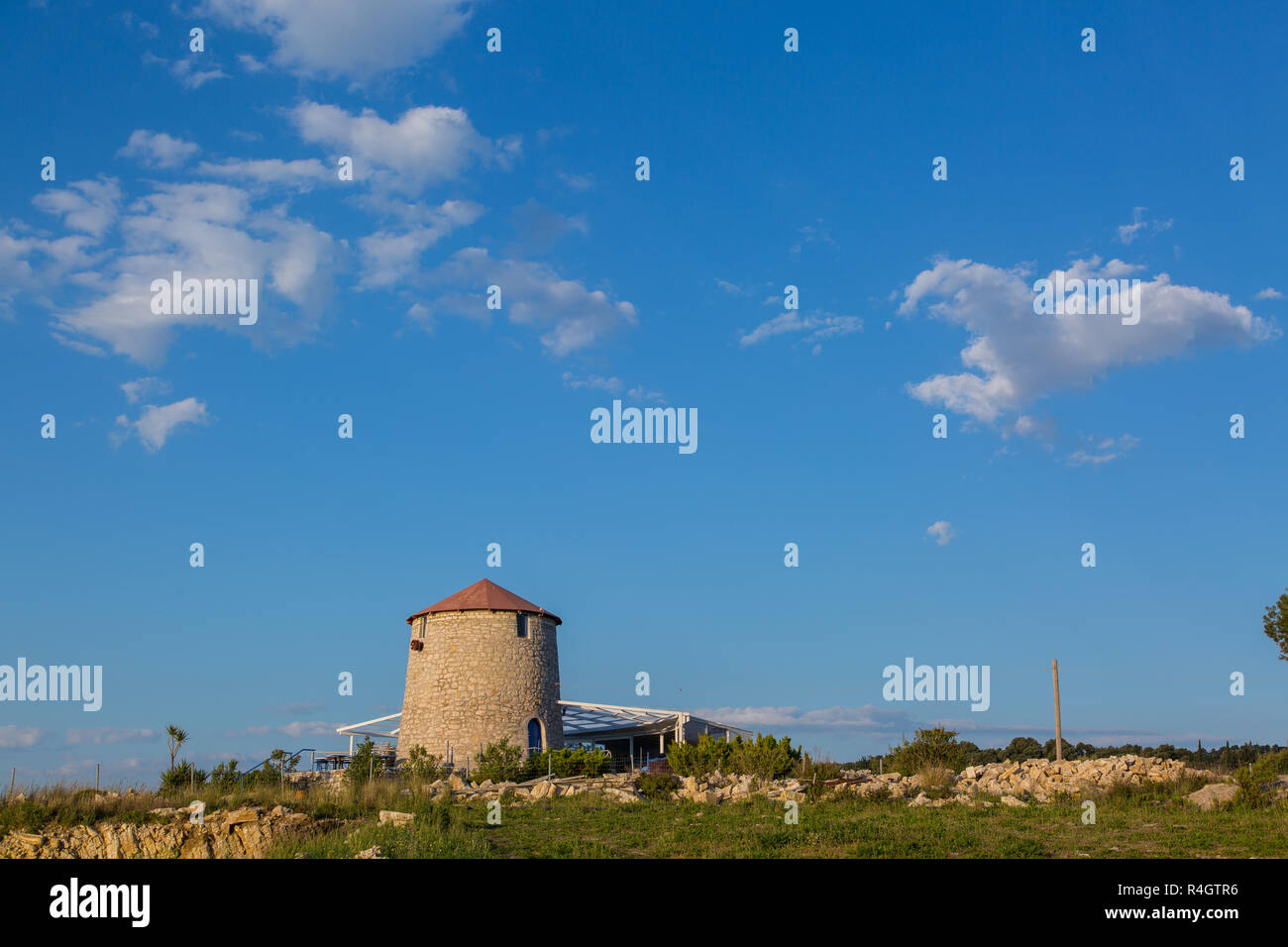 Windmill at Kastos island in Ionian sea Stock Photo - Alamy