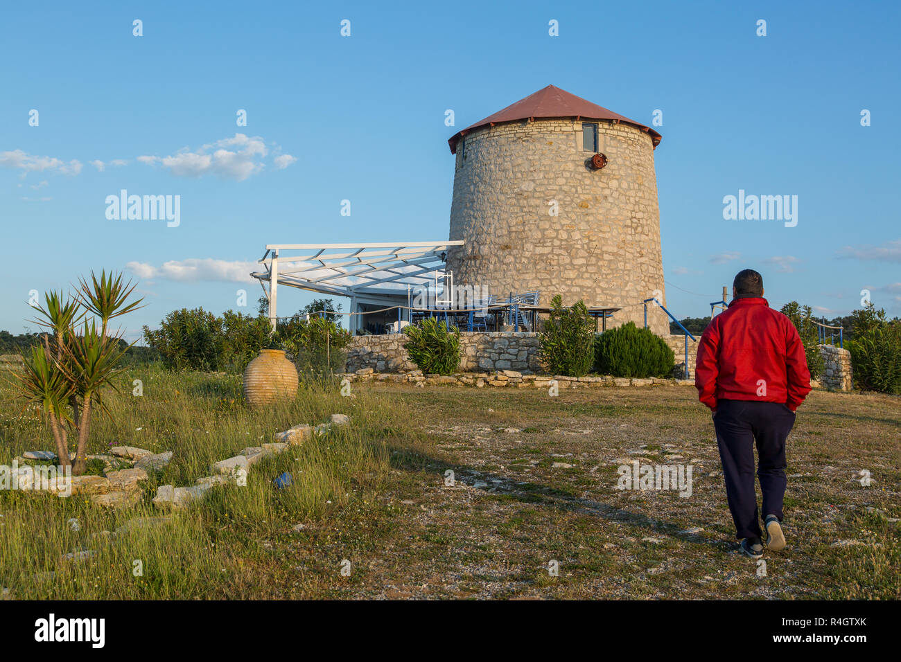 Windmill at Kastos island in Ionian sea Stock Photo - Alamy
