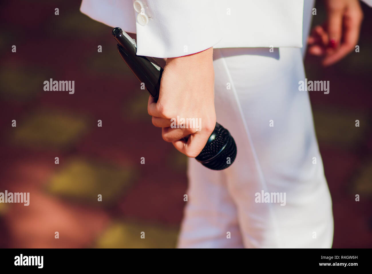 Master ceremony speech on microphone background wedding couple ...