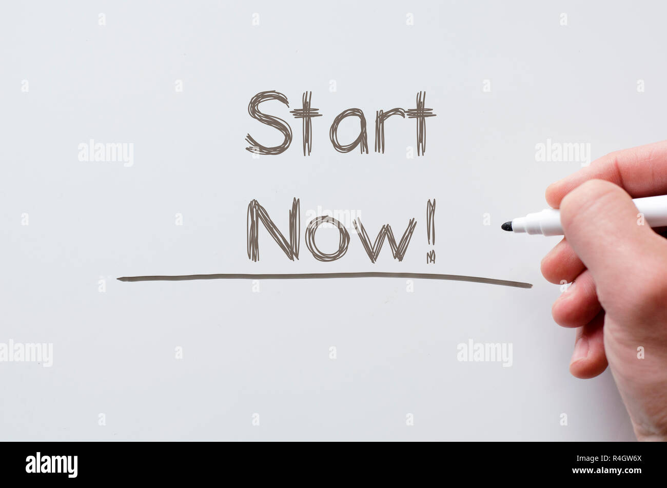 Start now written on whiteboard Stock Photo - Alamy
