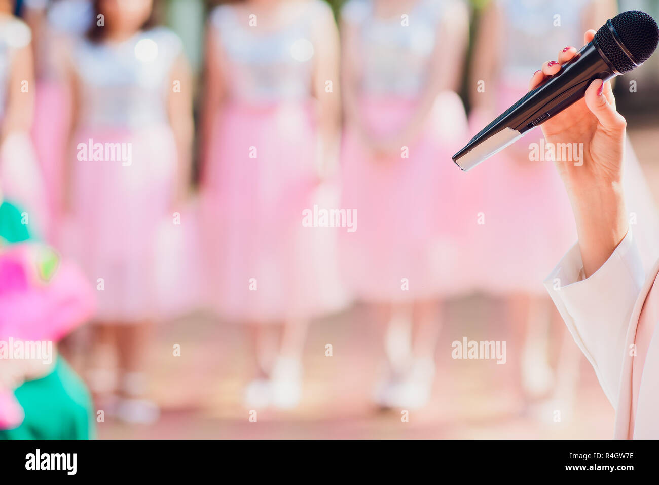 Master ceremony speech on microphone background wedding couple ...