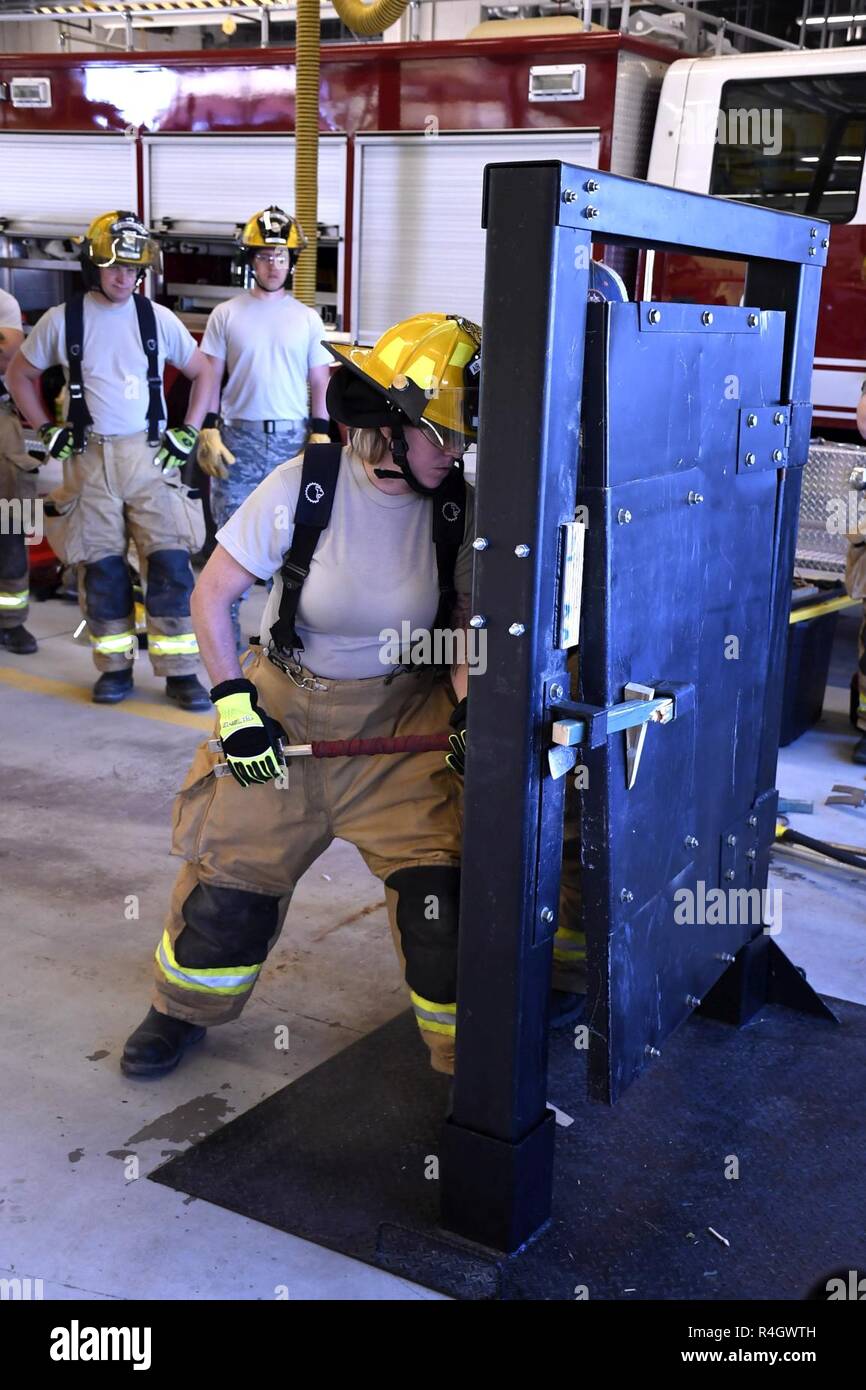 Airman with the civil engineer fire Department receive instruction from ...