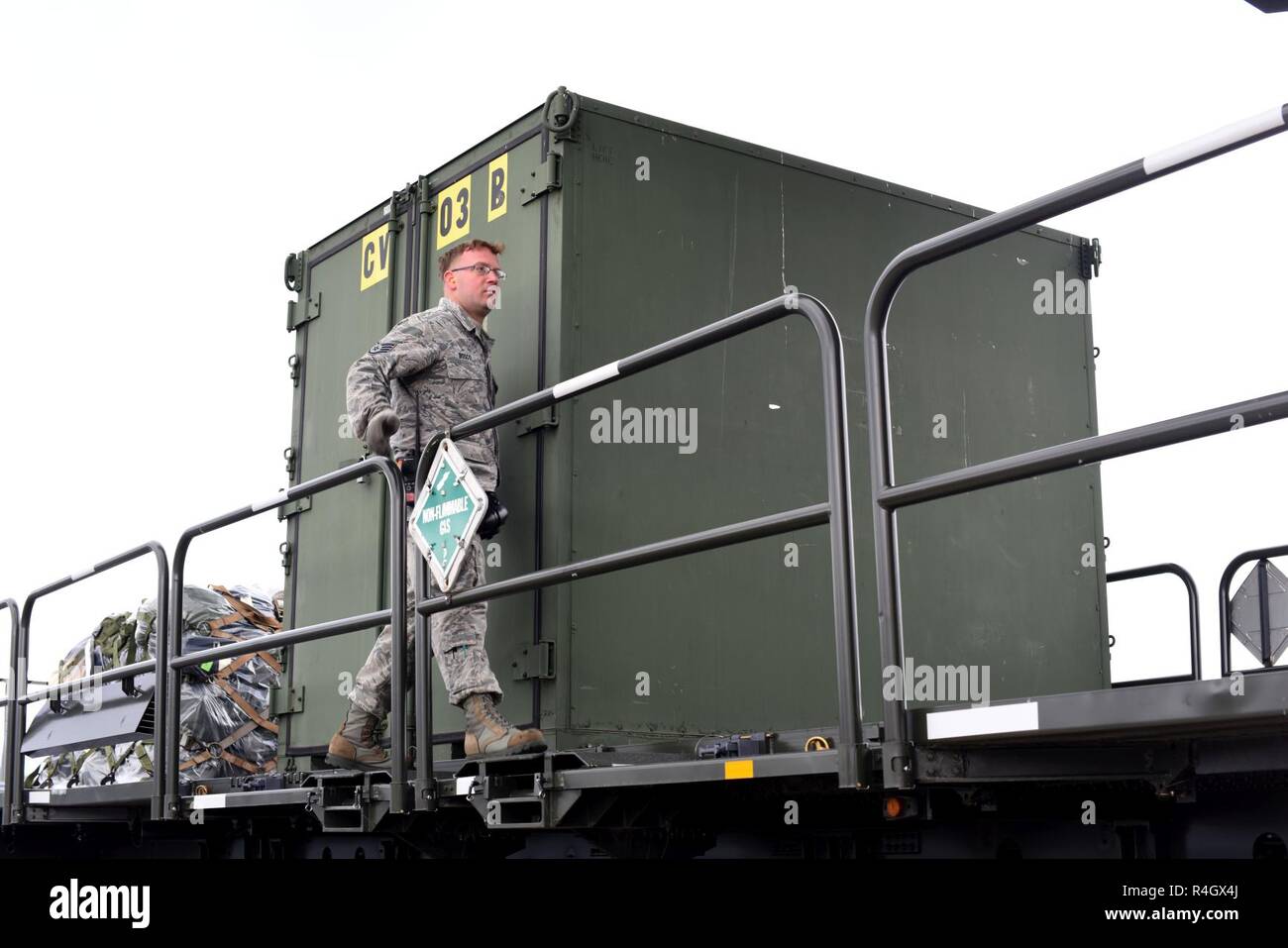 Staff Sergeant Bosco, an air trasportation specialist, waits to load a ...