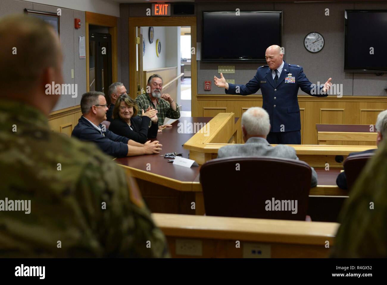 Maj. Richard Daigle acknowledges family members and friends during his ...
