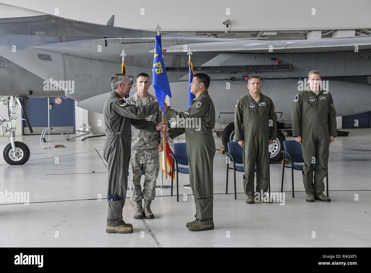 U.S. Air Force Col. Steven Early, 144th Operations Group commander, presents the 194th Fighter ...