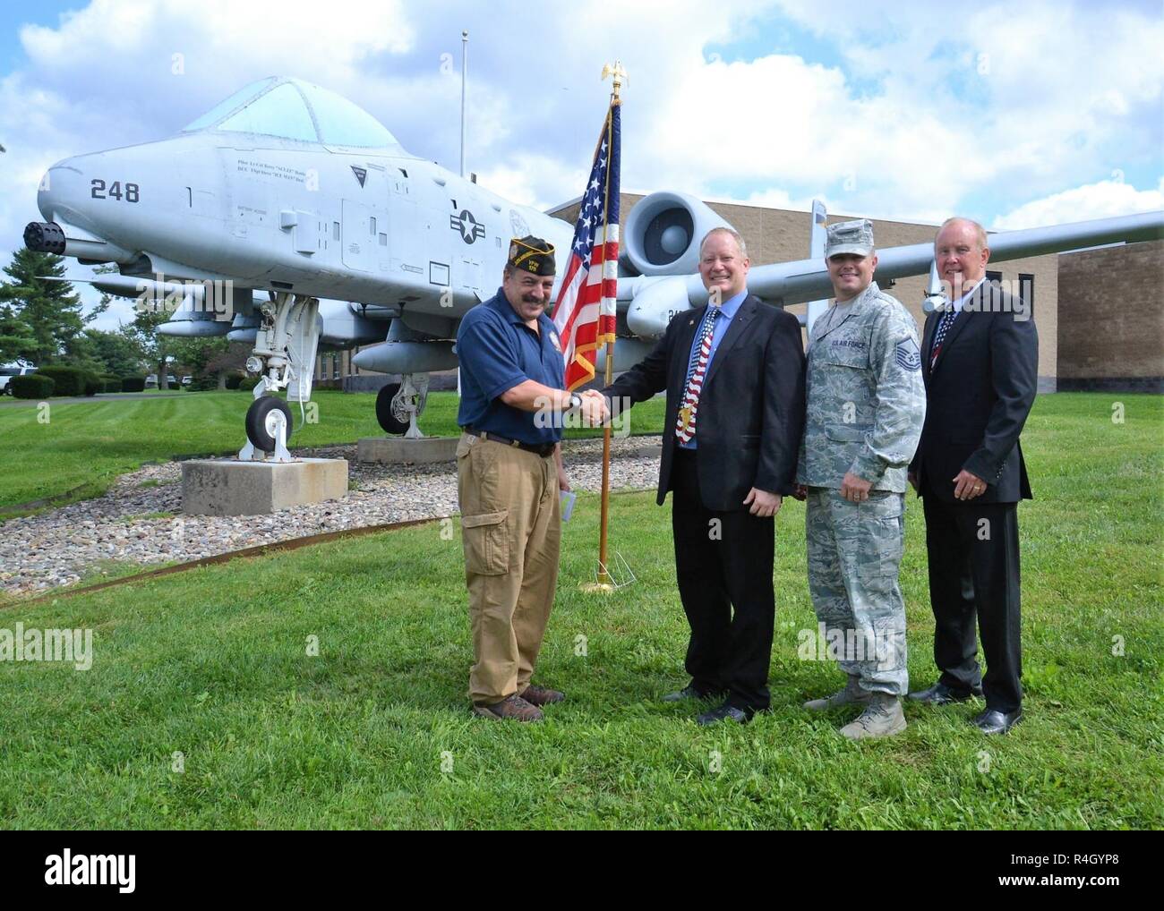 Air National Guard retired Col. Gregory Marston shakes hands with newly ...