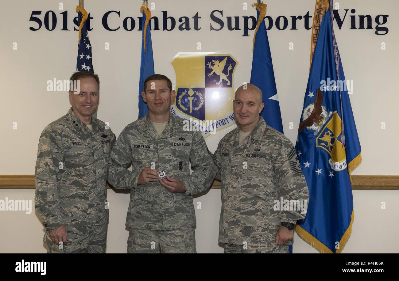 U.S. Air Force Maj. Gen. John M. Wood (left), Commander of 3rd Air Force, coins Master Sergeant ...
